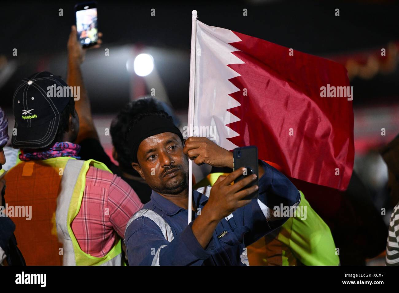 Al Ruwais, Qatar. 20th Nov, 2022. Residents of Al-Ruwais watch the ...
