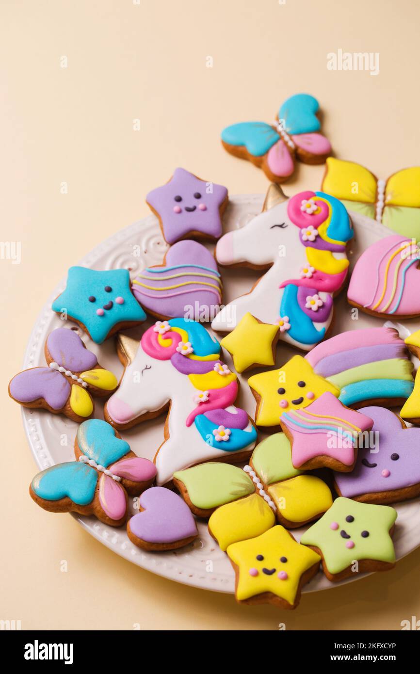 Ginger cookies in colored glaze for the holiday on a light background ...