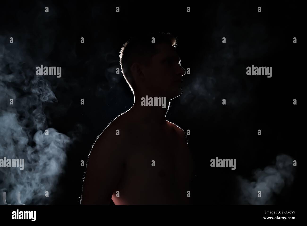 silhouette of a guy. men in the dark. smoke . steam . man in a dark ...