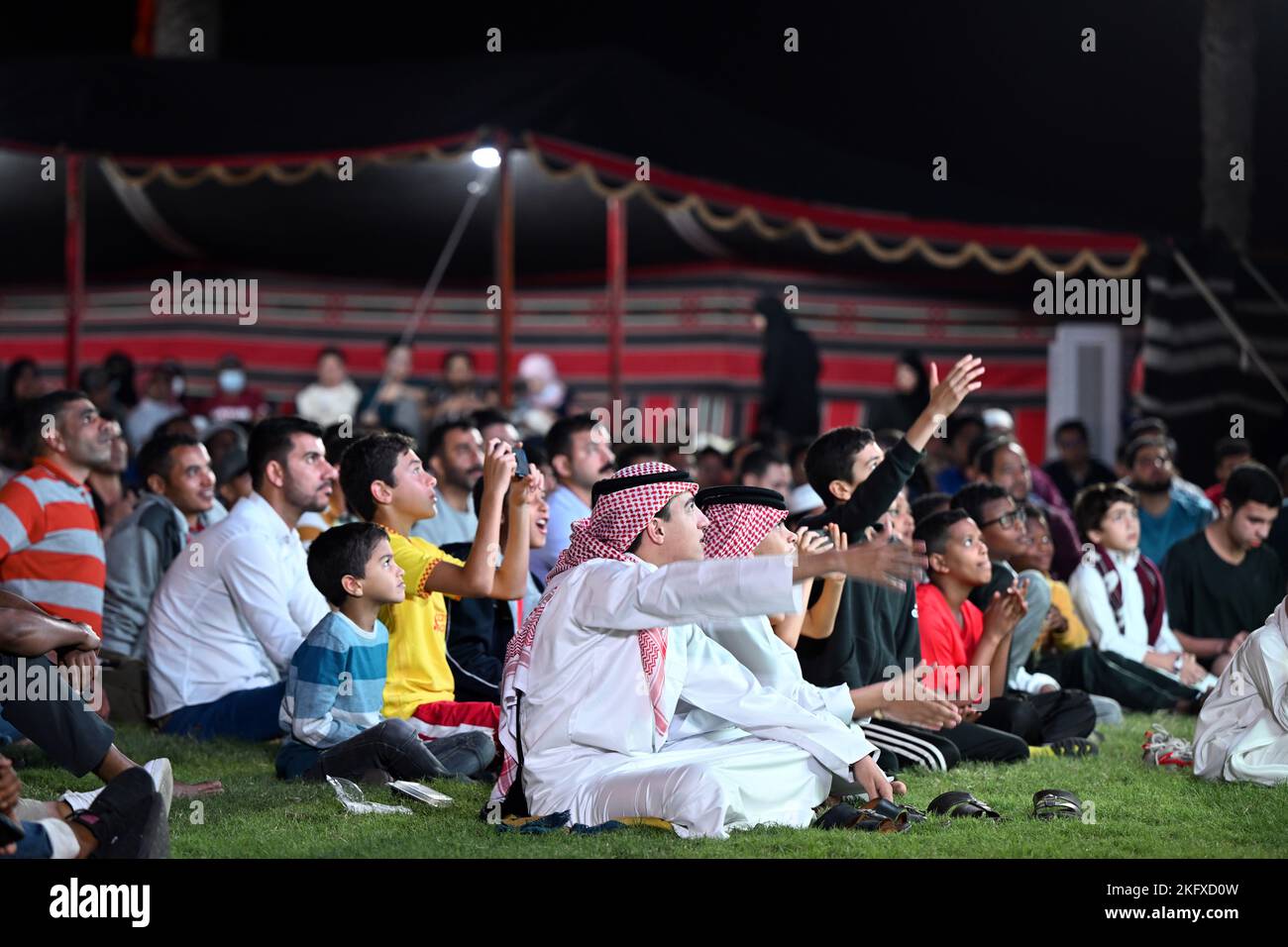 Al Ruwais, Qatar. 20th Nov, 2022. Residents of Al-Ruwais watch the ...