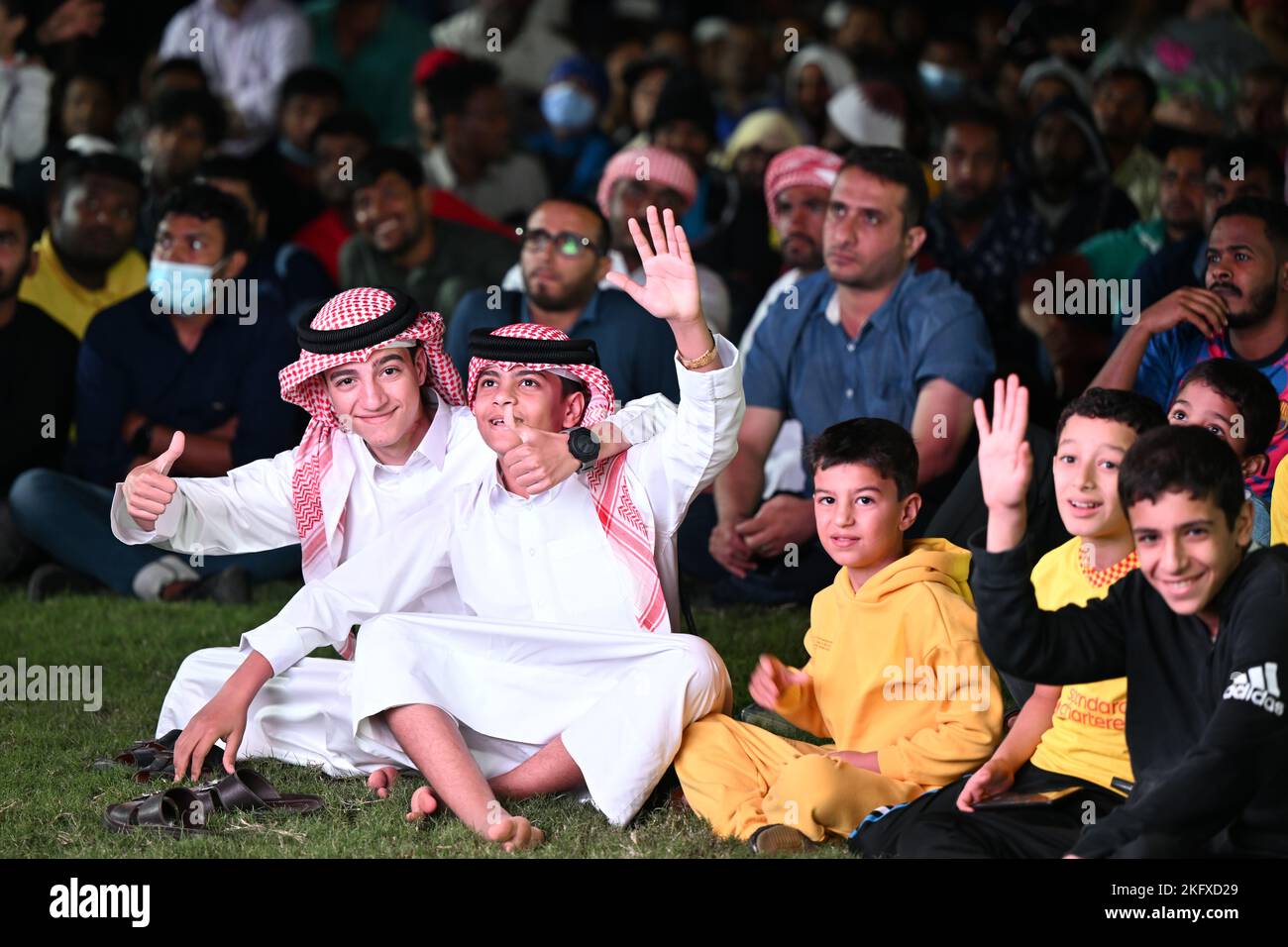 Al Ruwais, Qatar. 20th Nov, 2022. Residents of Al-Ruwais watch the ...