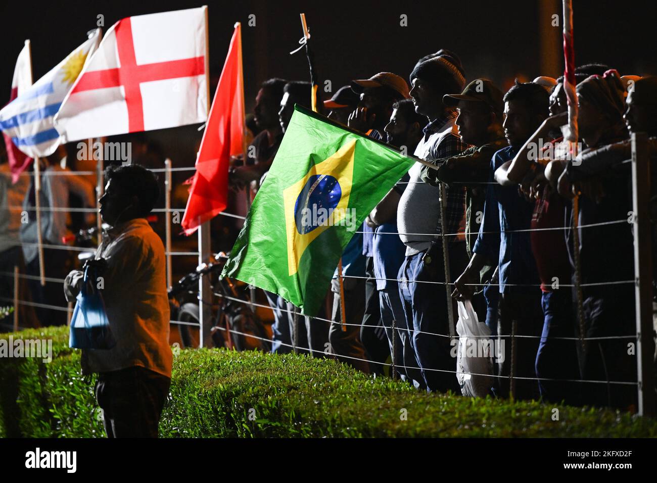 Al Ruwais, Qatar. 20th Nov, 2022. Residents of Al-Ruwais watch the ...