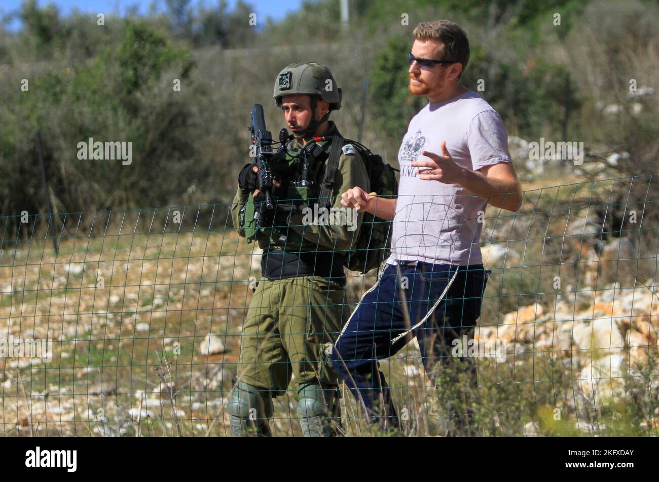 Salfit, Palestine. 20th Nov, 2022. Israeli soldiers guard Jewish ...