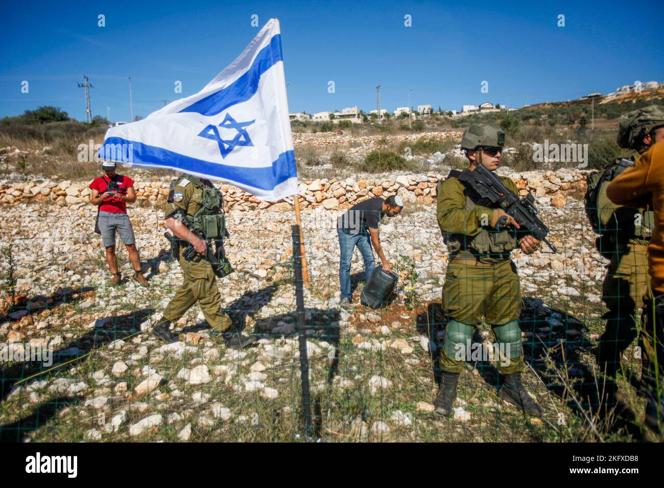 Salfit, Palestine. 20th Nov, 2022. Israeli soldiers guard Jewish ...