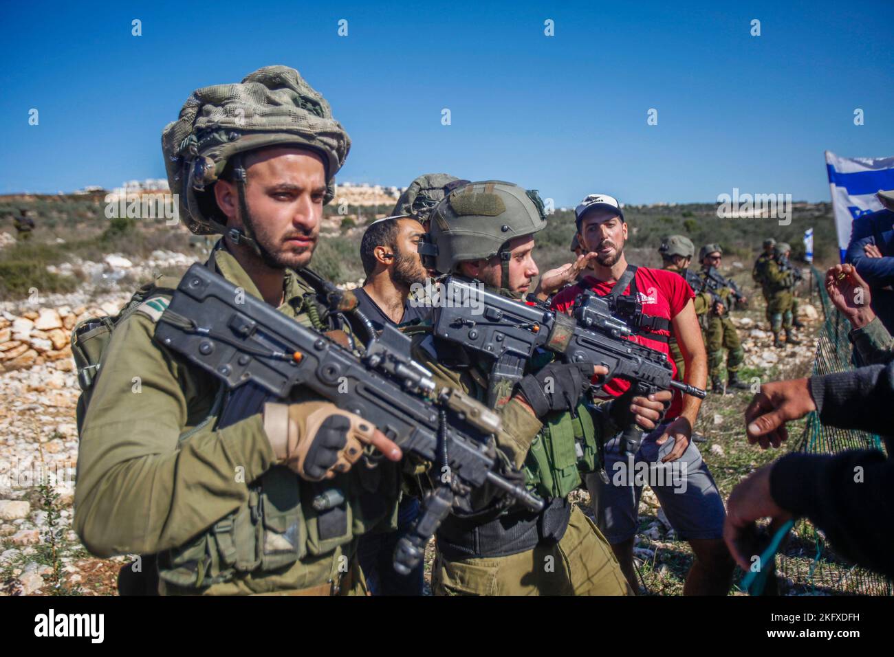Salfit, Palestine. 20th Nov, 2022. Israeli soldiers guard Jewish ...