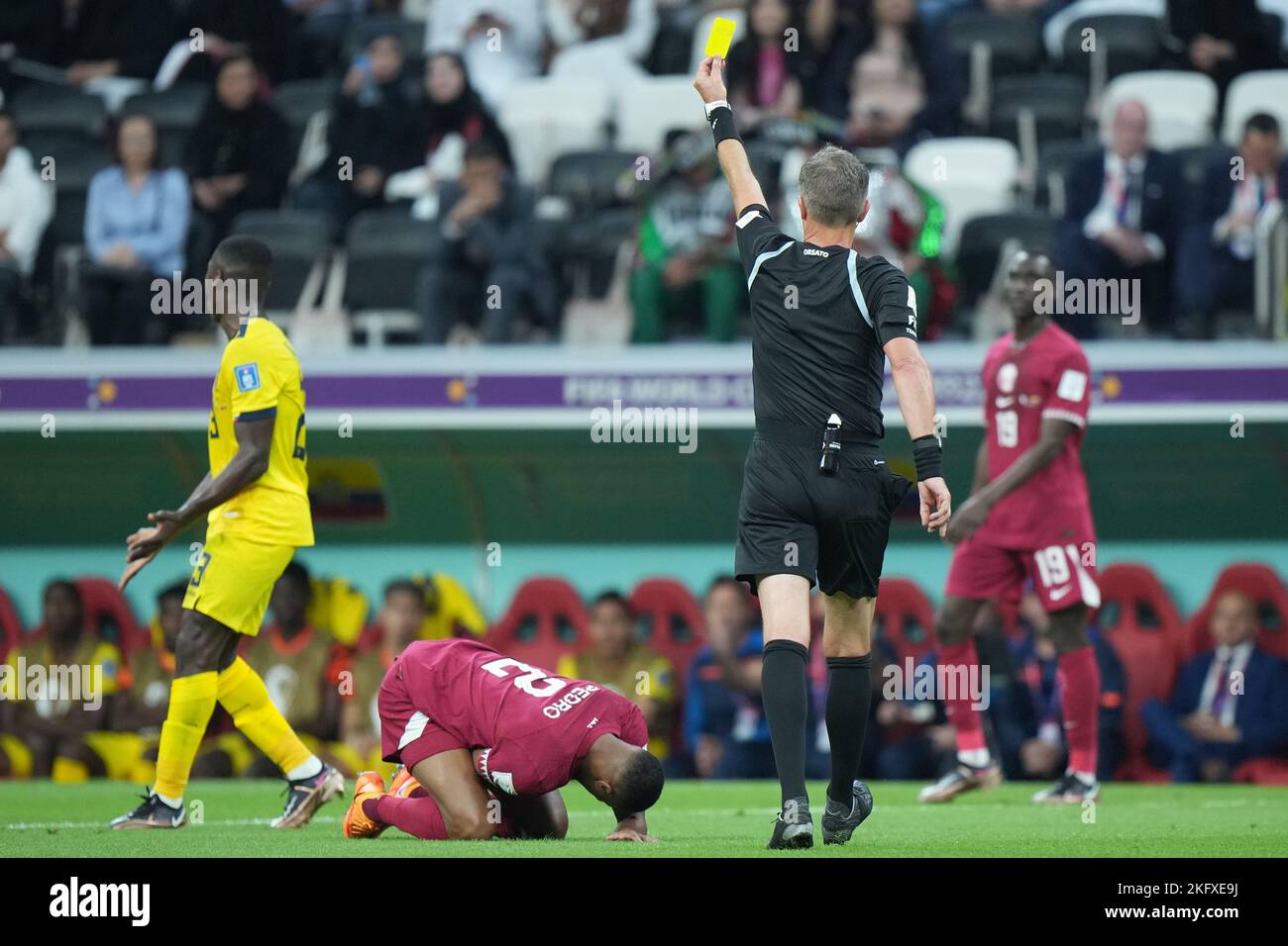 The referee shows yellow card during the Qatar 2022 World Cup match, group A, date 1, between ...