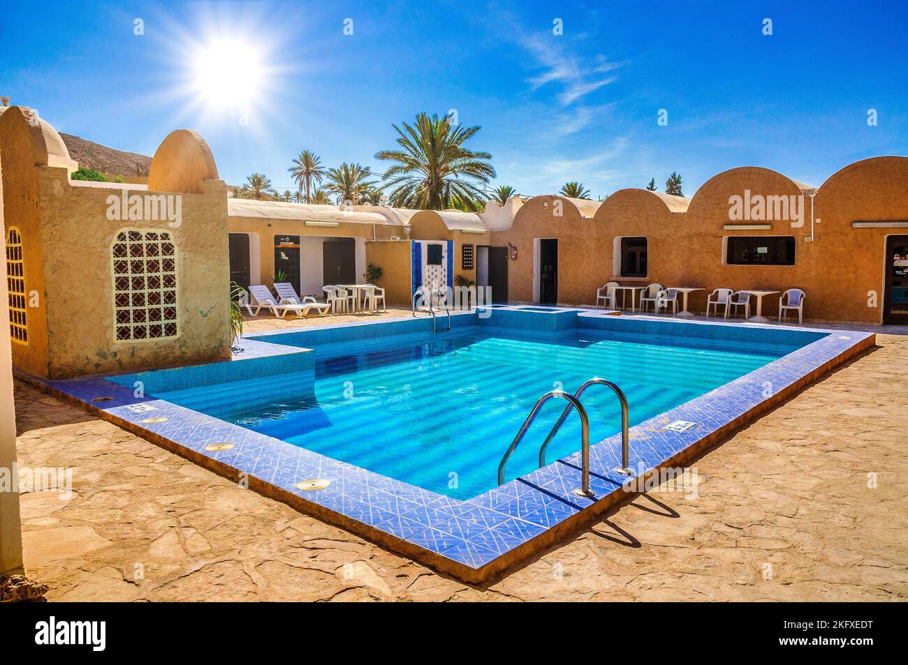 Fresh blue swimming pool in Hotel, Sahara desert, Tunisia, North Africa ...