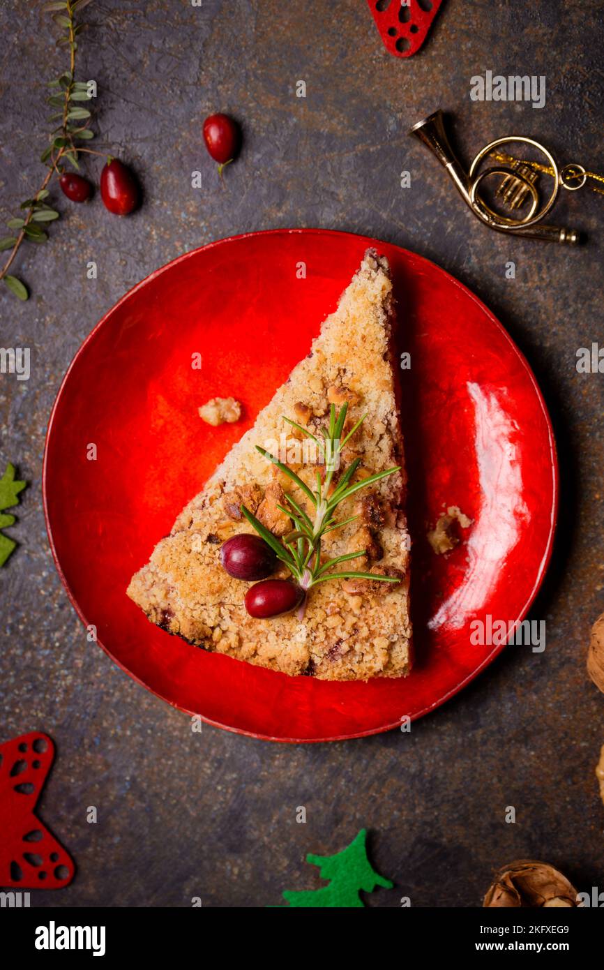 Grated cake with jam and nut filling on a metallic background Stock ...