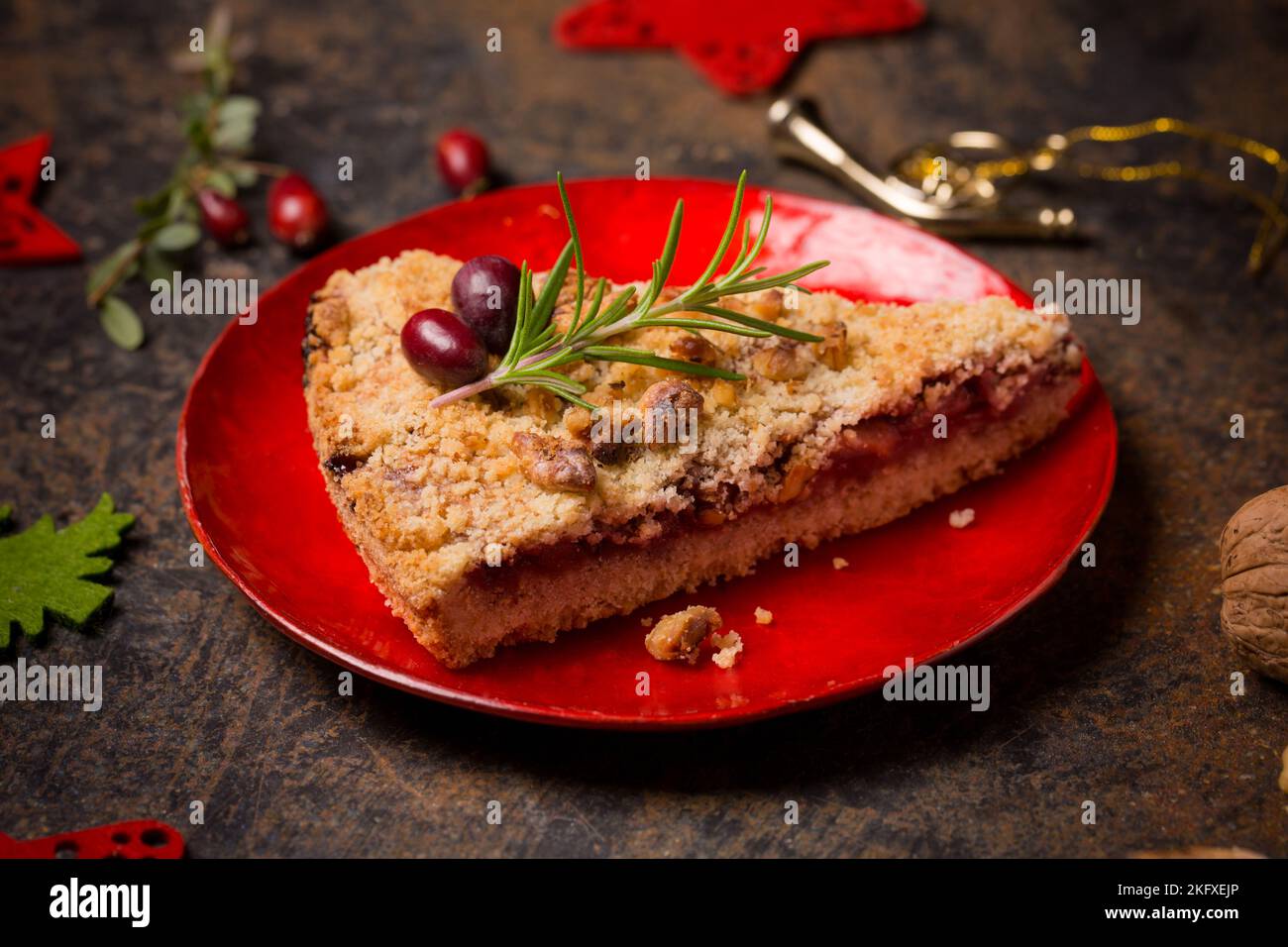 Grated cake with jam and nut filling on a metallic background Stock ...