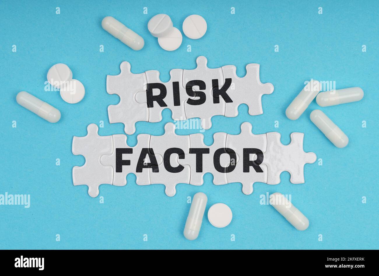 Medicine concept. On a blue background pills and puzzles with the ...