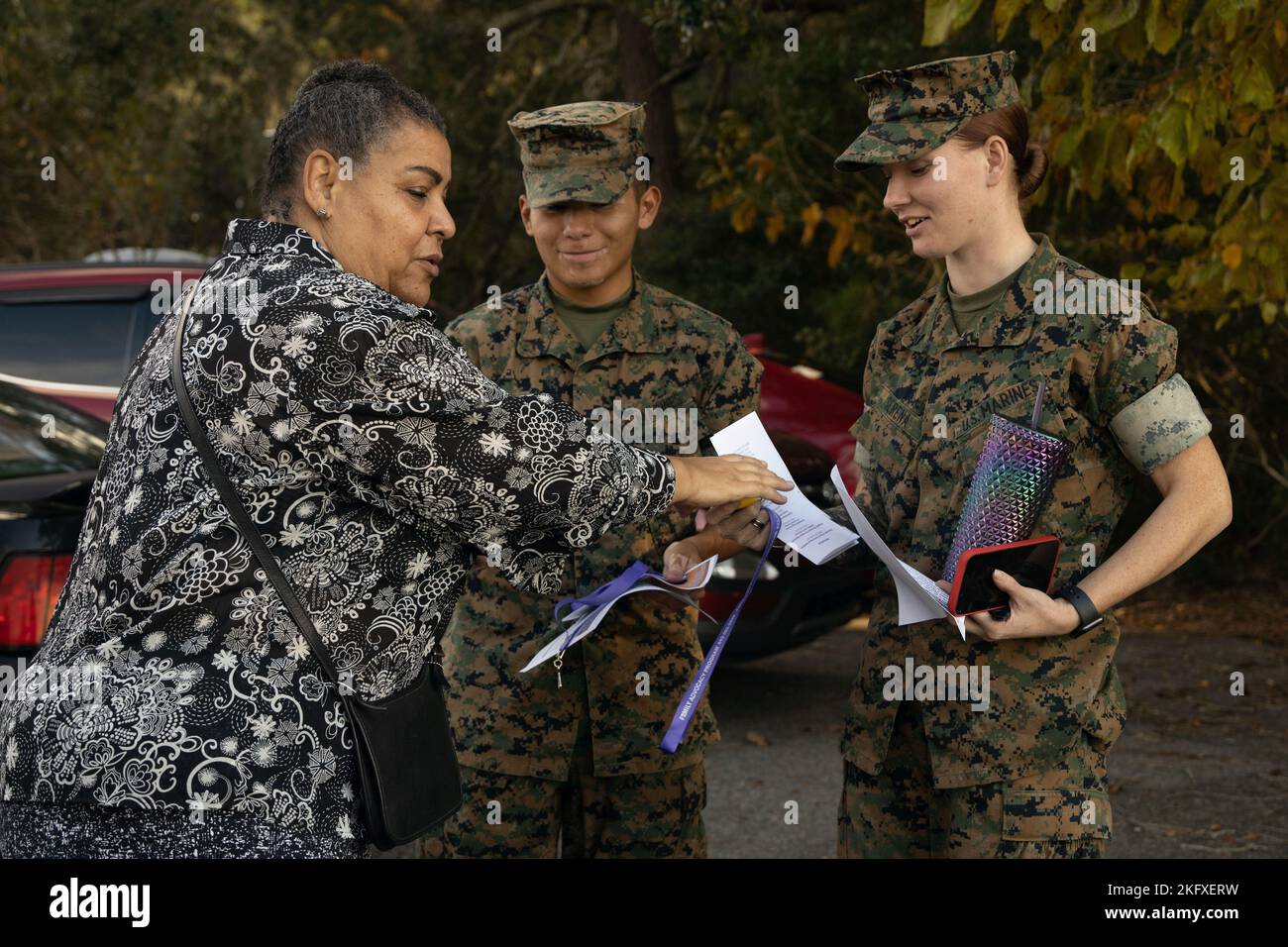 Martina Williams, Family Advocacy Program Victim Advocate, hands U.S ...
