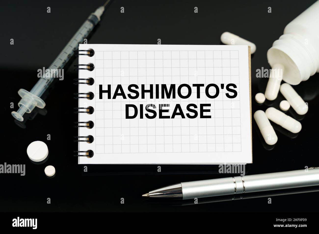 Medicine and healthcare concept. On the black surface are pills, a ...