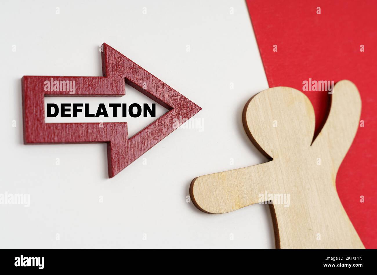 Economy and business concept. On a red-white surface, a human figure ...