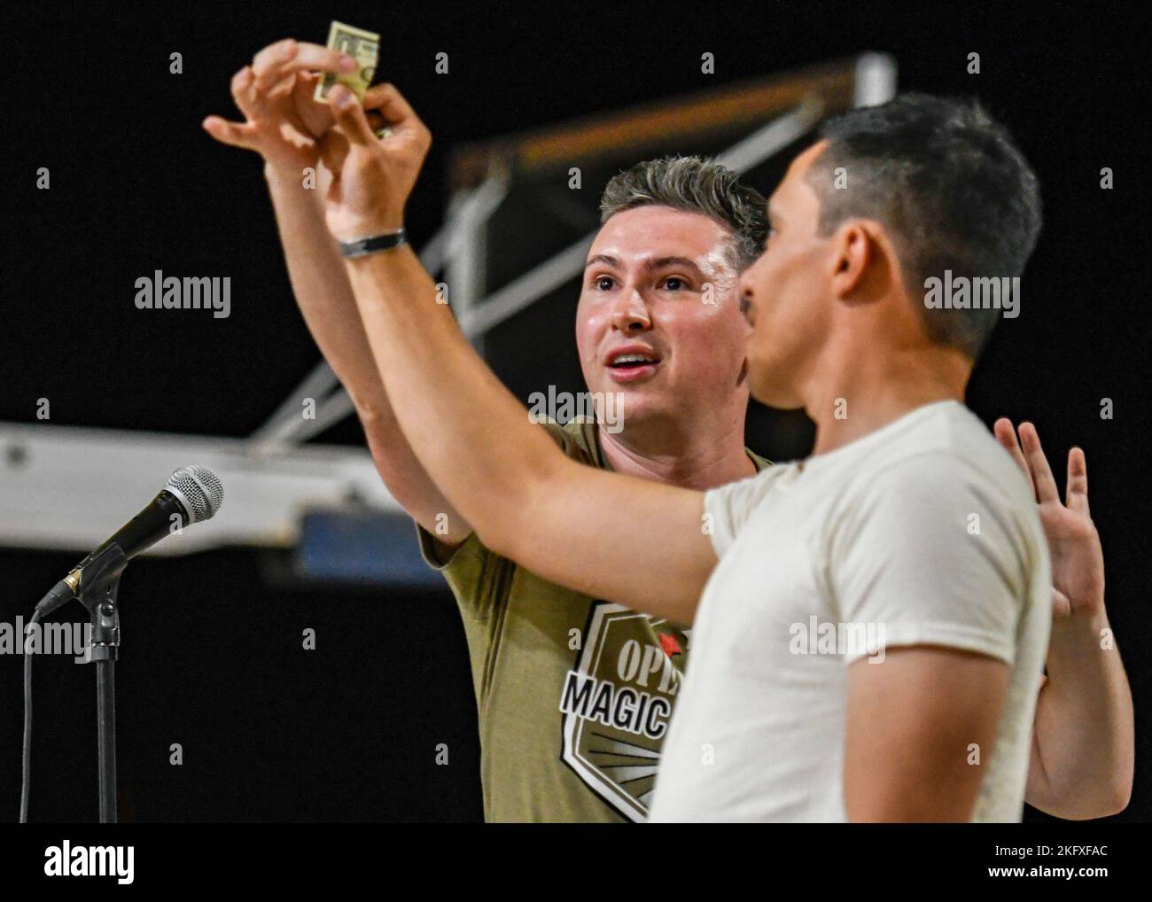 Ben Young, a magician with Operation Magic All Stars, performs a torn ...