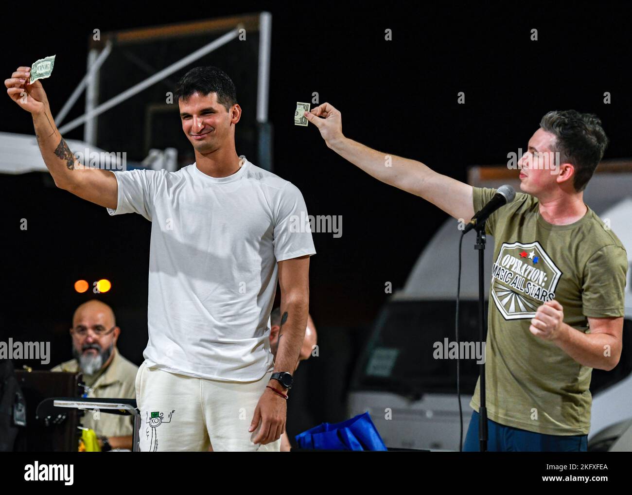 Ben Young, a magician with Operation Magic All Stars, performs a torn ...