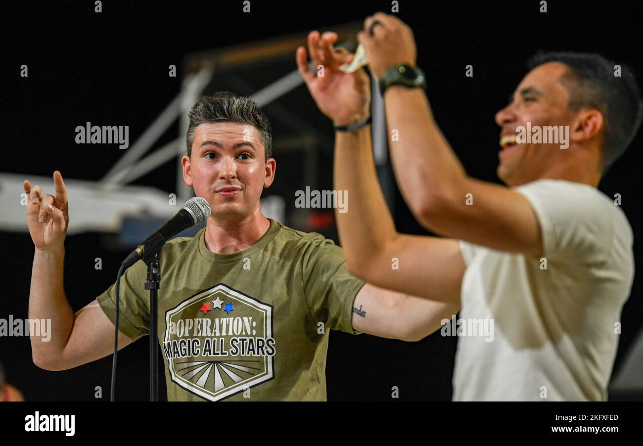 Ben Young, a magician with Operation Magic All Stars, performs a torn ...