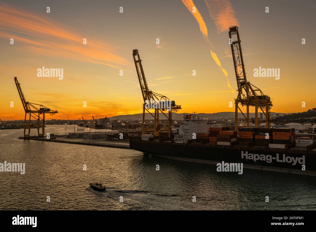Three cranes at Sunset Muelle Sur Container Terminal, Barcelona Spain ...