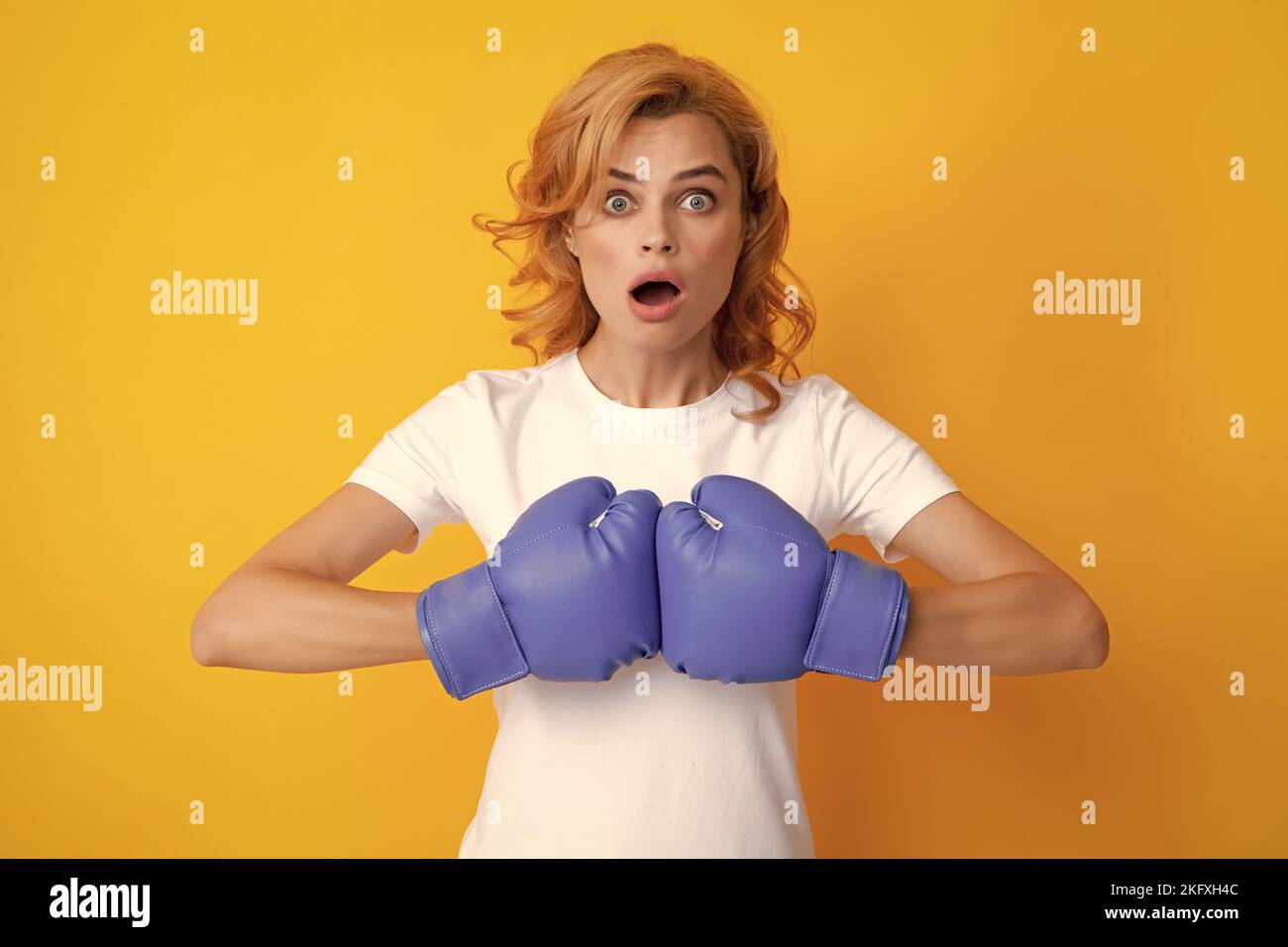 Surprised female boxer. Woman in boxing gloves Stock Photo - Alamy