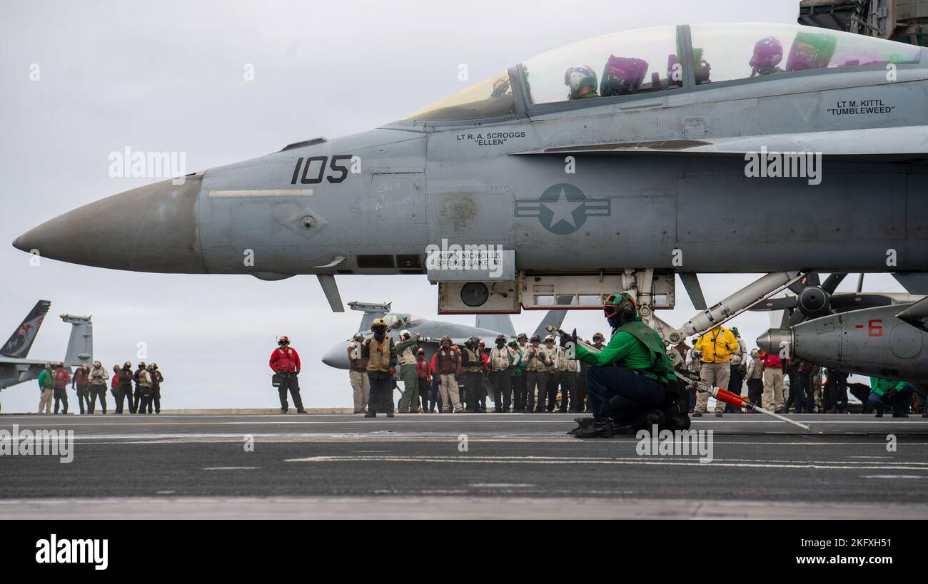 221014-N-DU622-1068 PACIFIC OCEAN (Oct. 14, 2022) Two sailors give the ...
