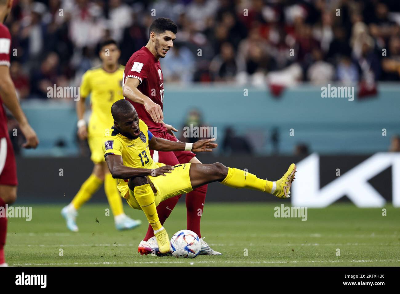 AL KHOR - (l-r) Enner Valencia of Ecuador, Karim Boudiaf of Qatar ...