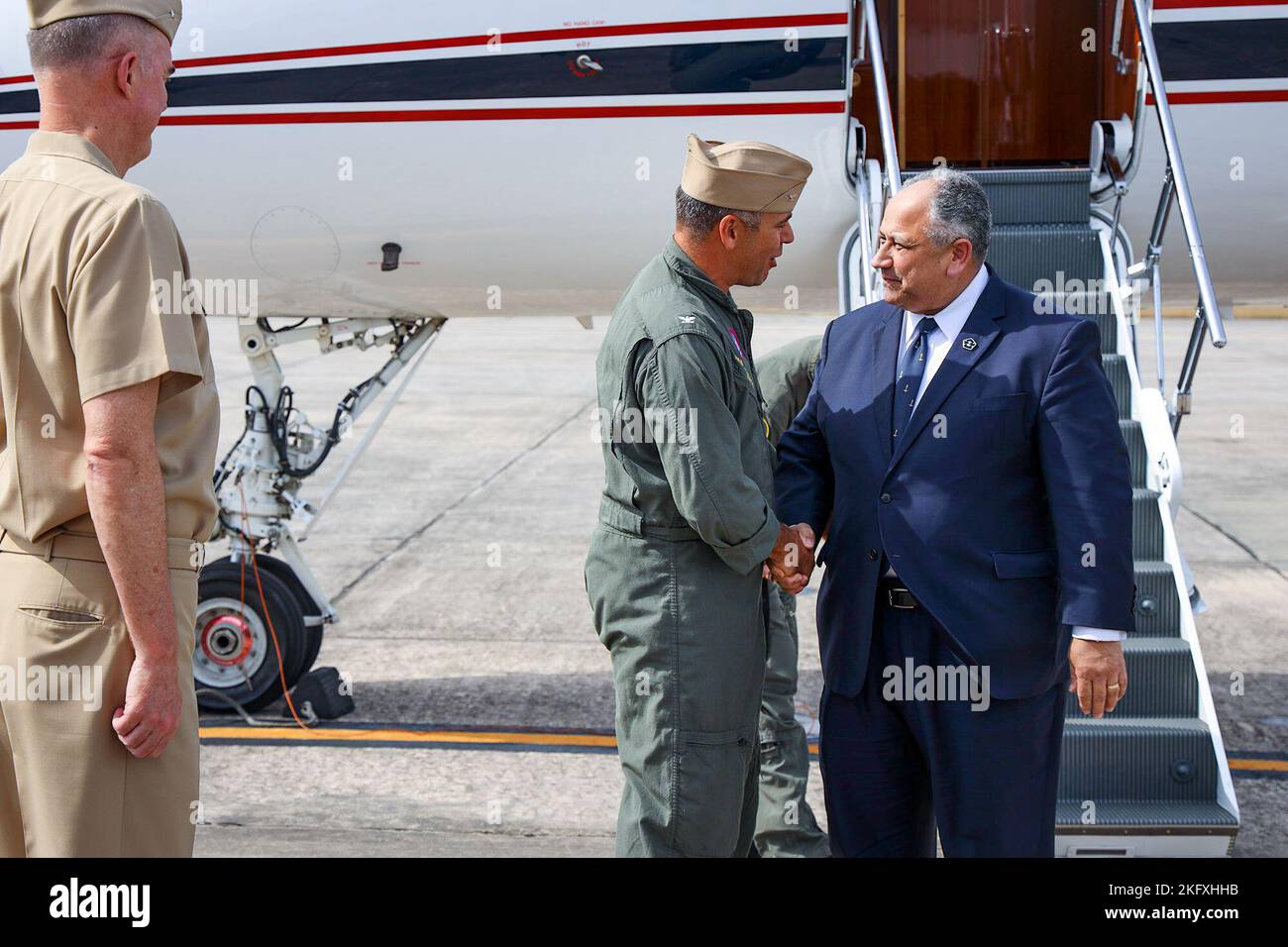 Secretary of the Navy Carlos Del Toro is greeted by Capt. Terrence ...