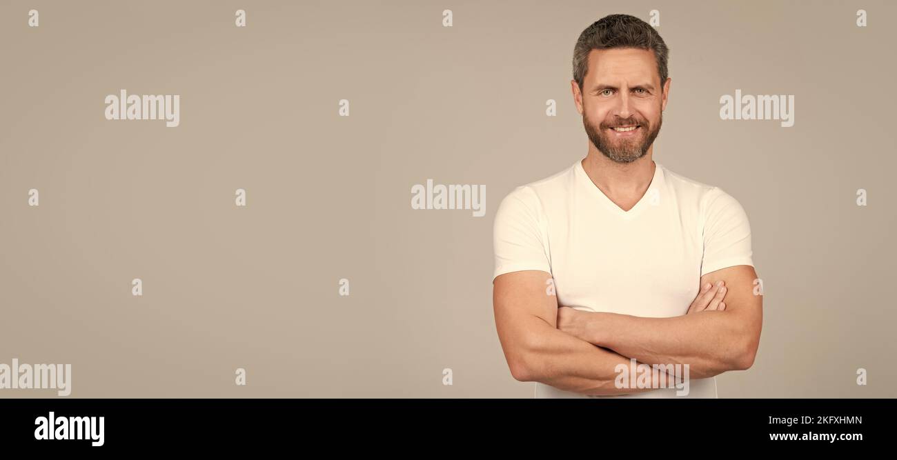 Happy confident man smile keeping arms crossed in white tshirt grey ...