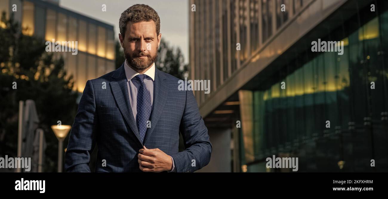 successful man in businesslike suit. manager executive outside the ...