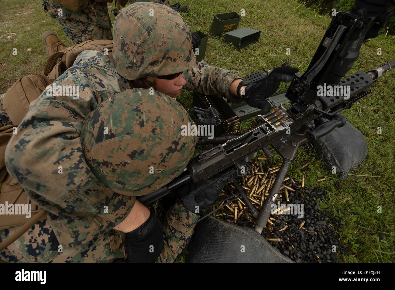 U.S. Marine Corps Lance Cpl. Tyler Belanger, top, a motor vehicle ...