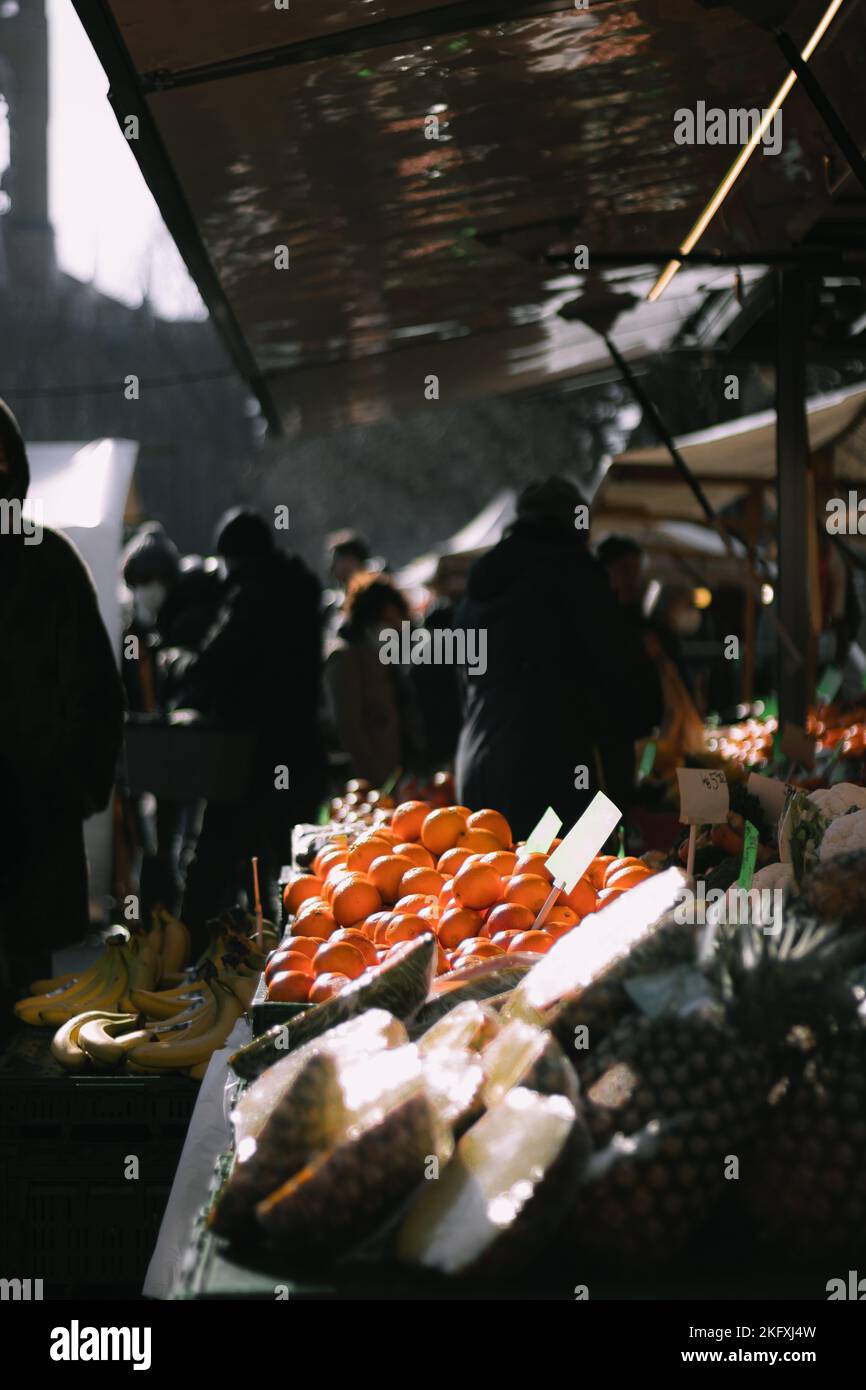 A vertical shot of fresh fruits at a stand at an outdoor market Stock ...