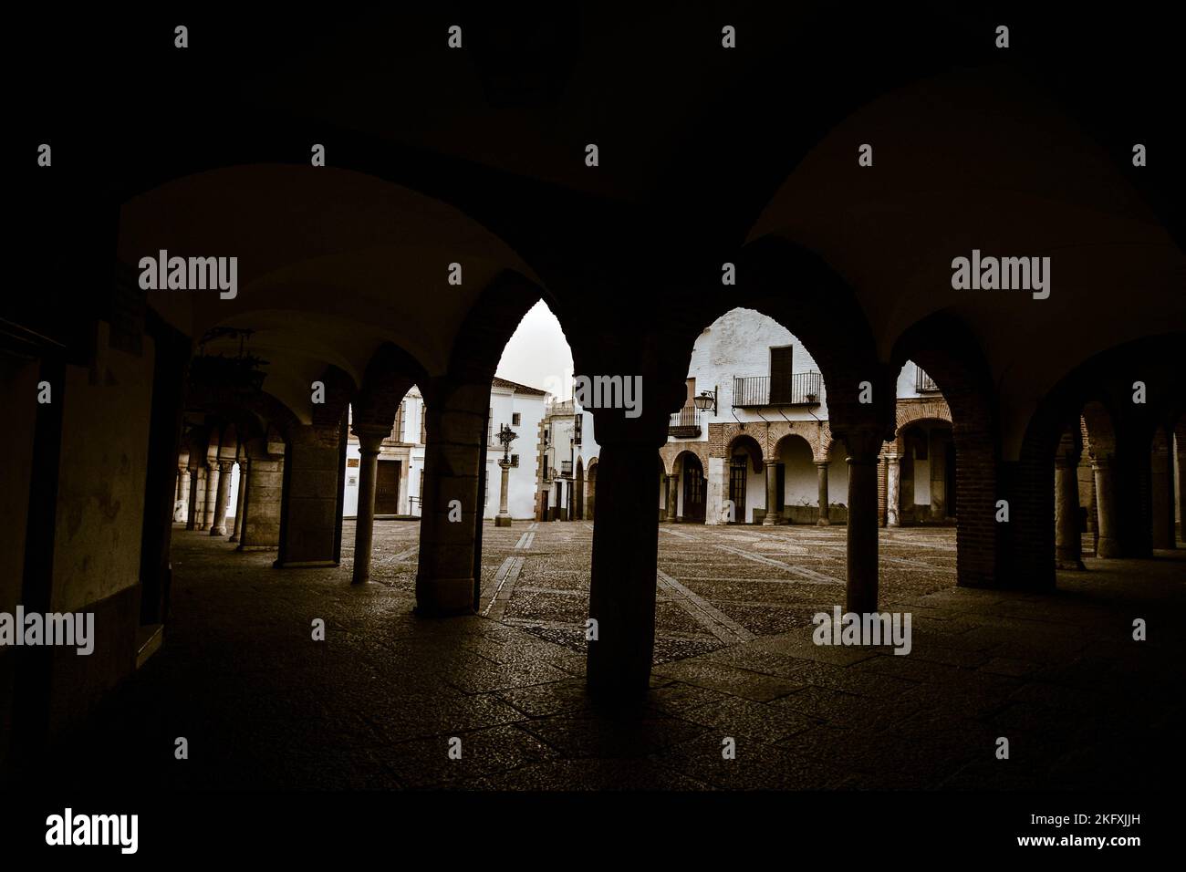 A beautiful shot of the historic columns of Plaza Chica in Badajoz ...