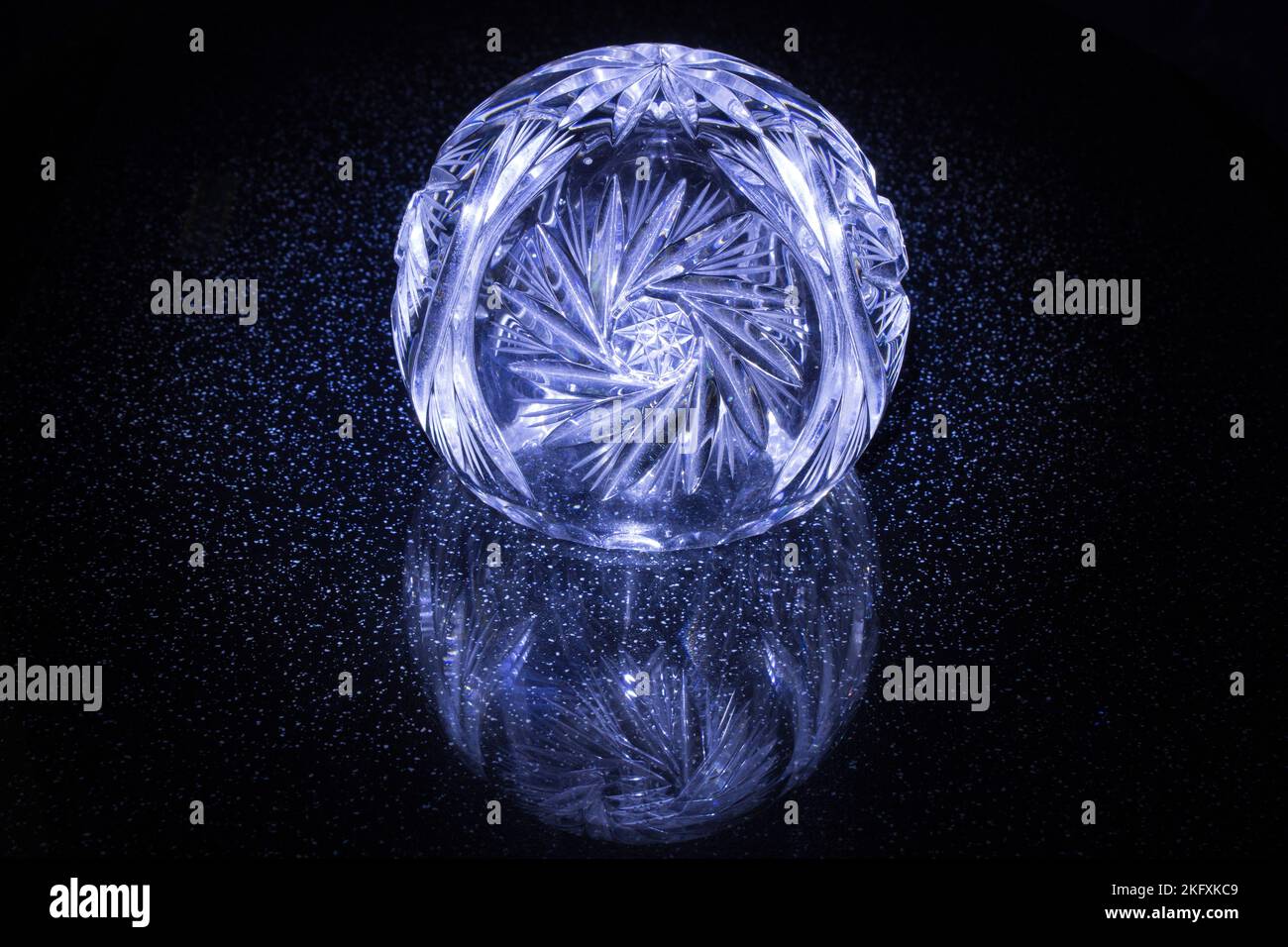 Light and crystal ball 22.11.2022 Bialystok Poland. Dark background and ...