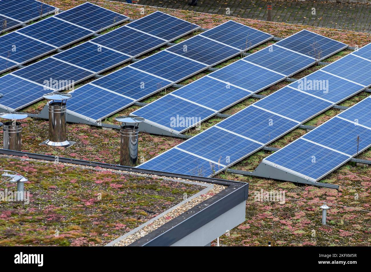 Solar panels on the roof of a building to supply electrical energy into ...