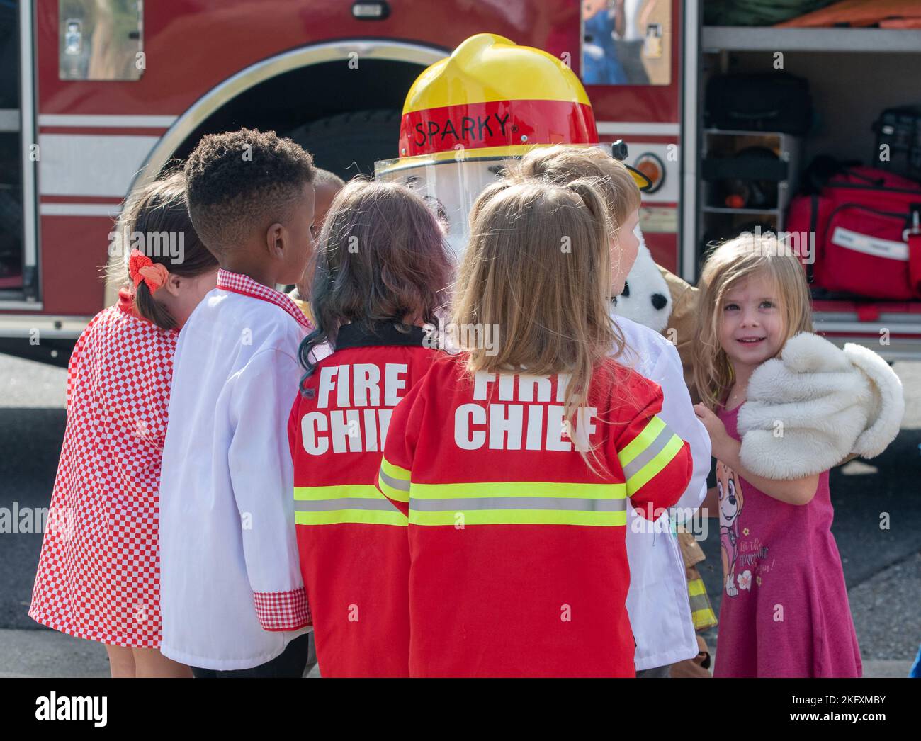 Children from the Child Development Center receives a hug from Sparky ...