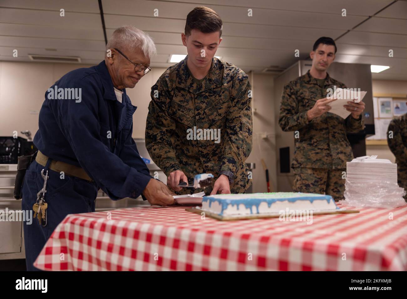U.S. Navy Petty Officer 2nd Class Tanner Brophy, middle, a corpsman ...