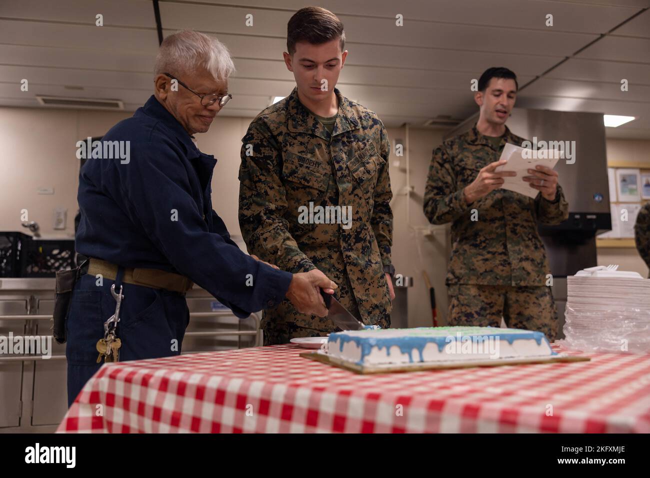 U.S. Navy Petty Officer 2nd Class Tanner Brophy, middle, a corpsman ...