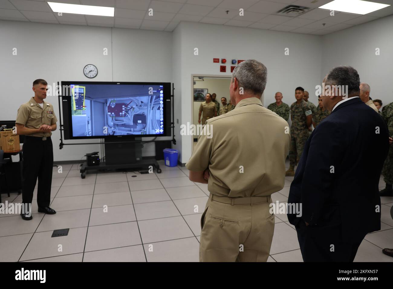 Secretary of the Navy Carlos Del Toro and Rear Adm. Pete Garvin ...