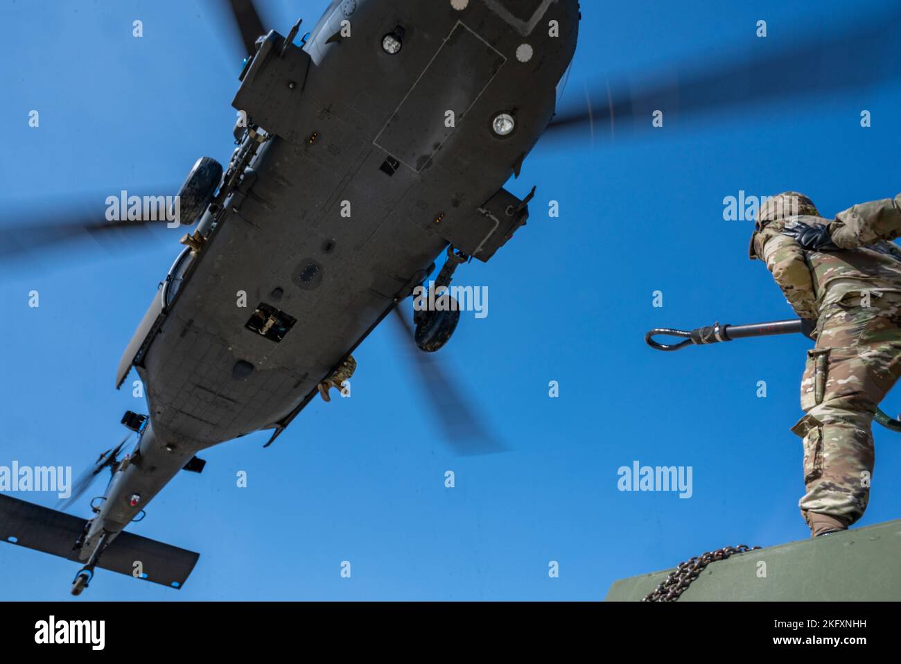 A U.S. Air Force 51st Maintenance Squadron maintainer prepares to hook ...