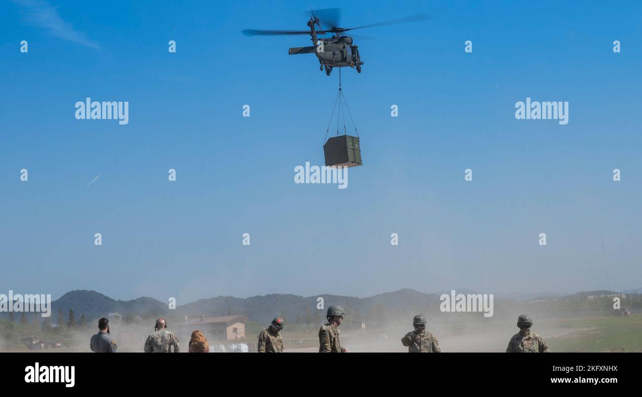 A U.S. Army Black Hawk helicopter carries an Internal Slingable Unit ...