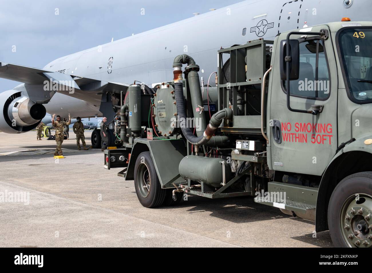 An Airman from the 22nd Air Refueling Wing marshals an R-12 refueling ...