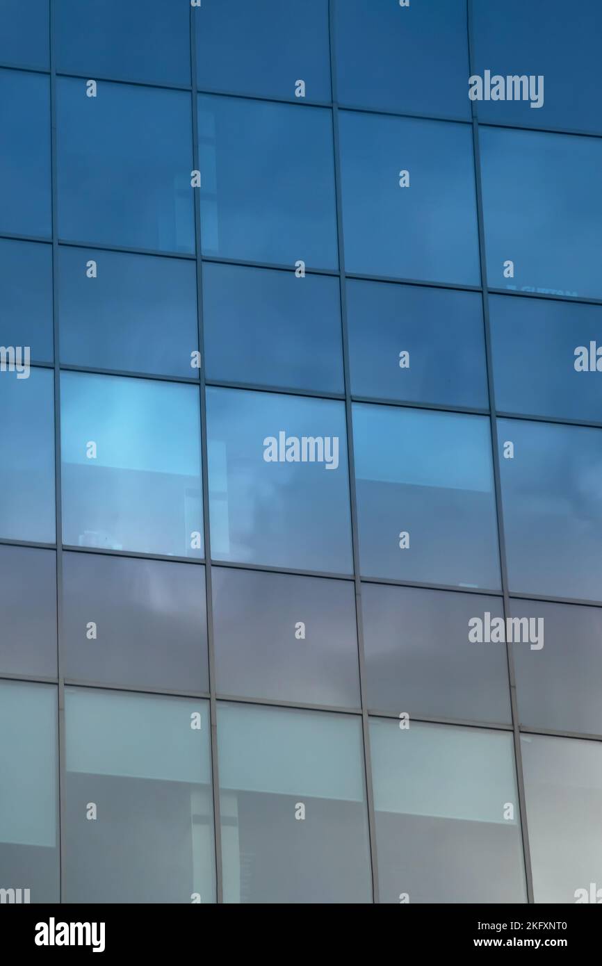 Reflection of clouds in the mirrored windows of the building Stock ...