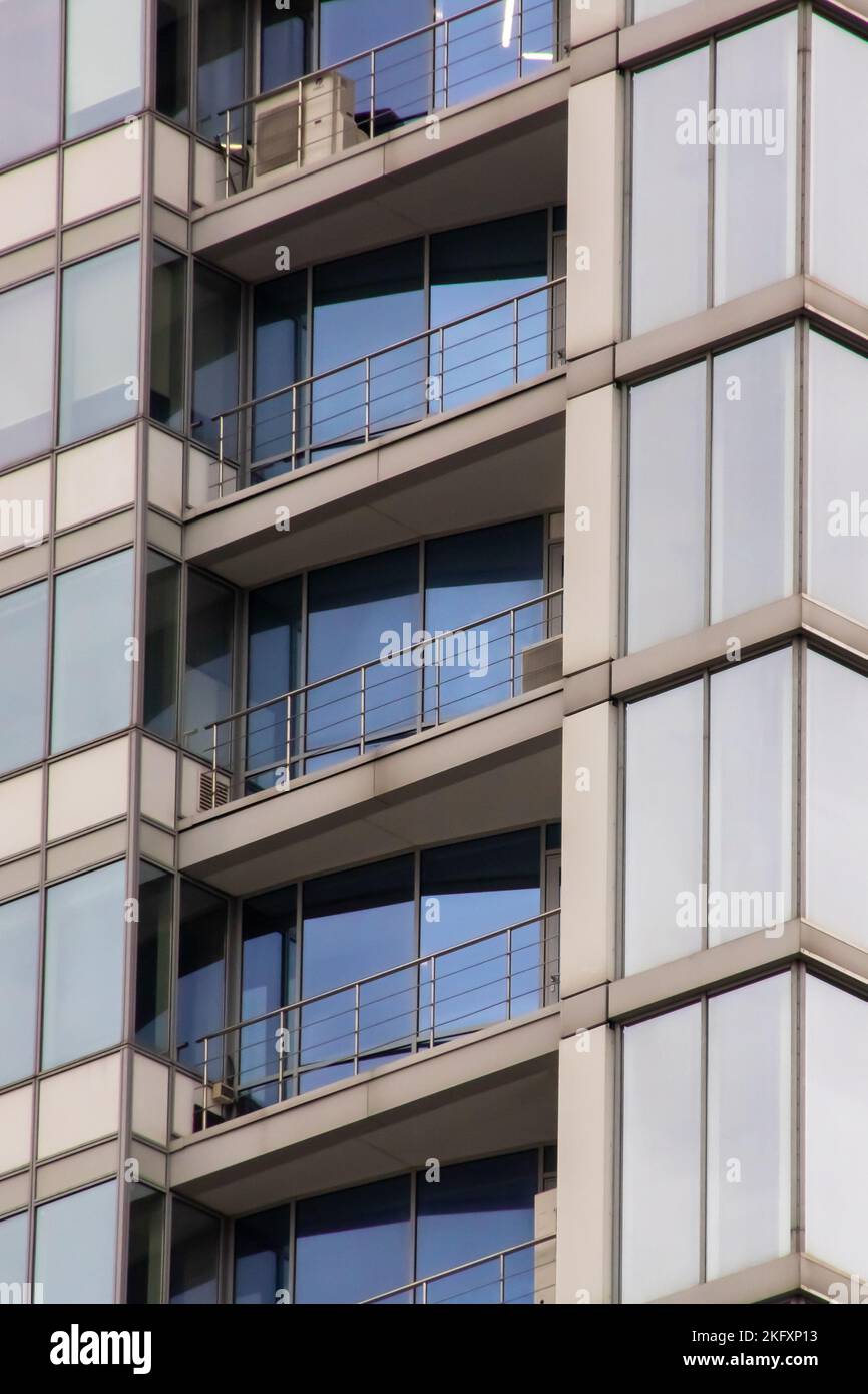 Balconies on a glass tall building close up Stock Photo - Alamy