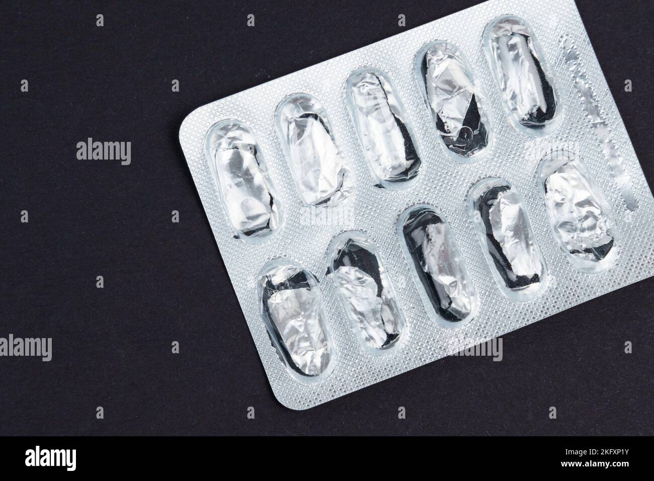 Medicine concept. On the black surface is an empty pill pack Stock ...