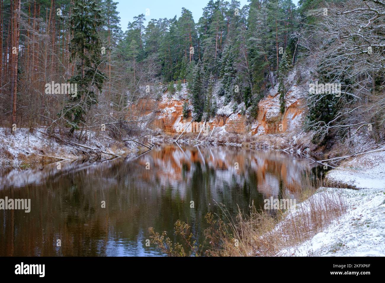 View of red sandstone cliffs. Salaca river. Skanaiskalns nature park ...