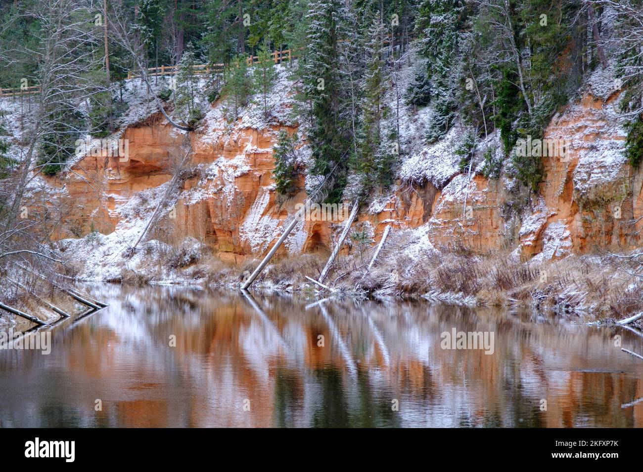 View of red sandstone cliffs. Salaca river. Skanaiskalns nature park ...