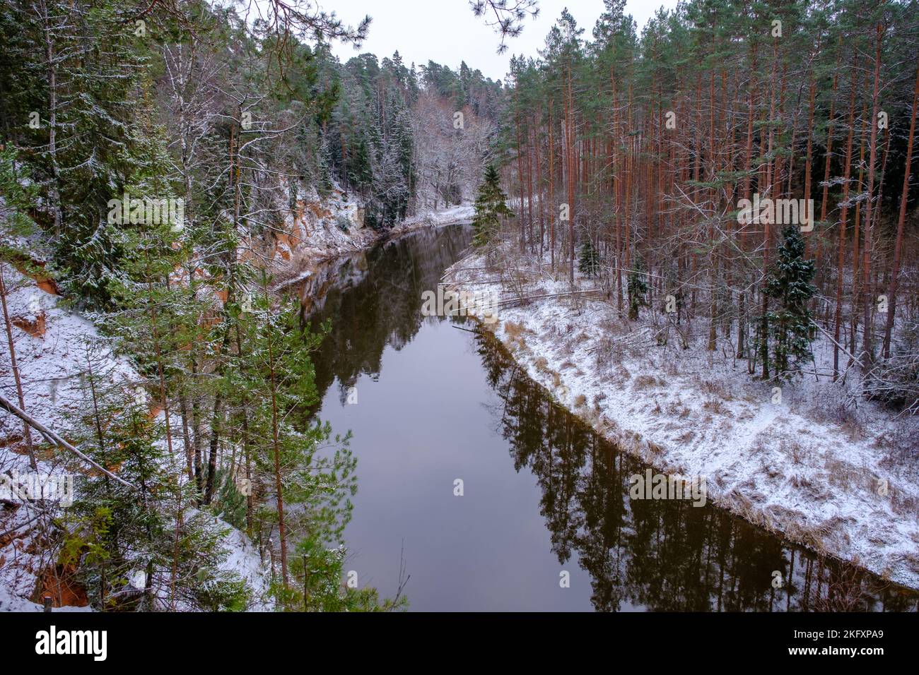 The river Salaca is meandered by high sandstone cliffs. Skanaiskalns ...