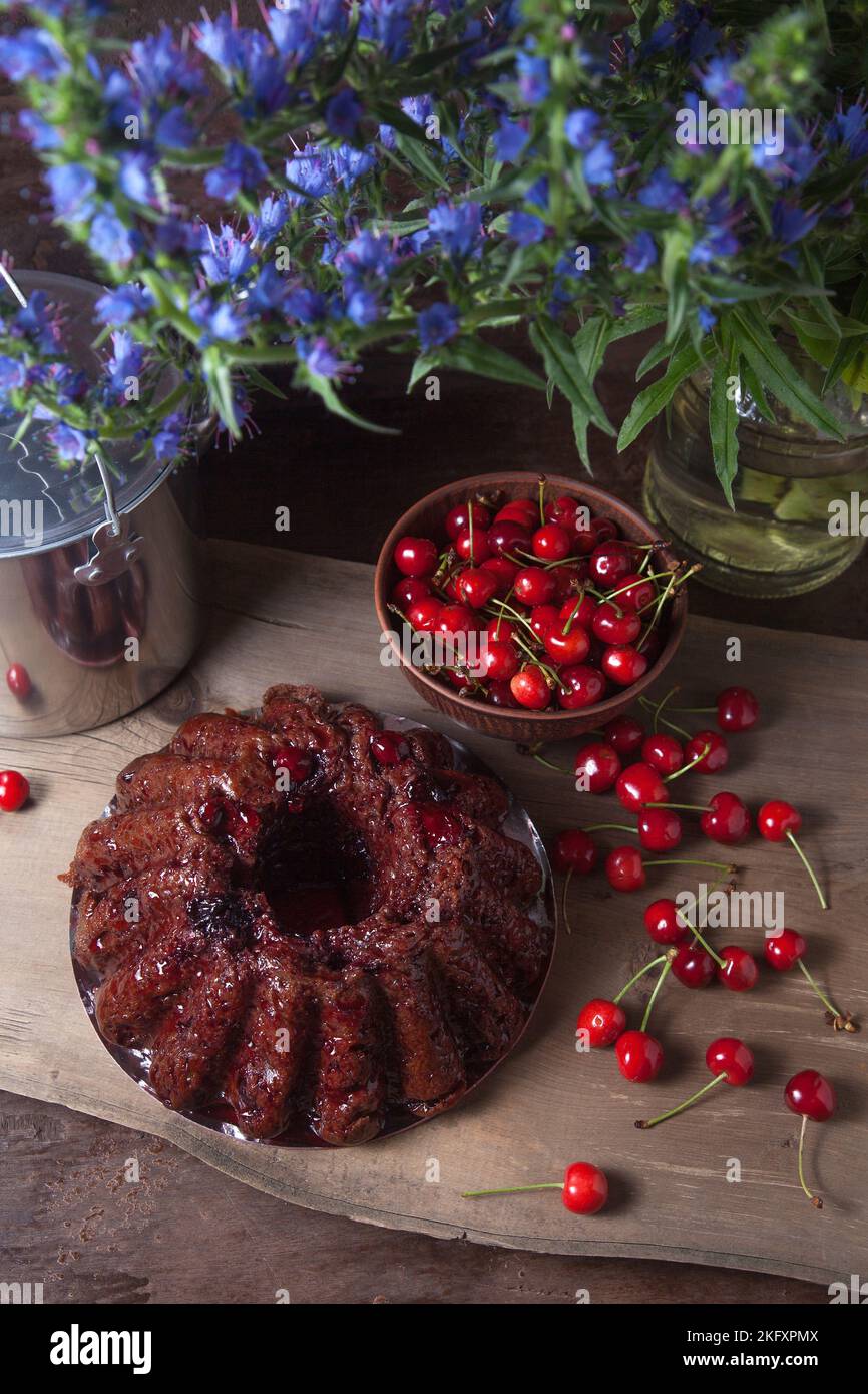 Composition on dark wooden background - delicious chocolate cake with ...
