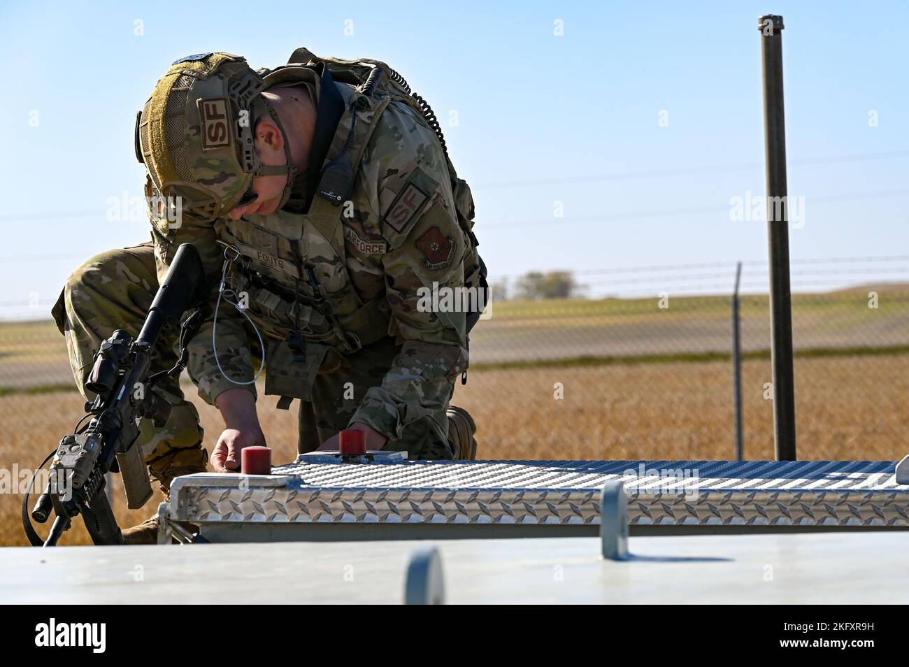 Airman 1st Class Jonah Fouts, a 91st Security Forces Group Defender unlocks a Launch Facility ...