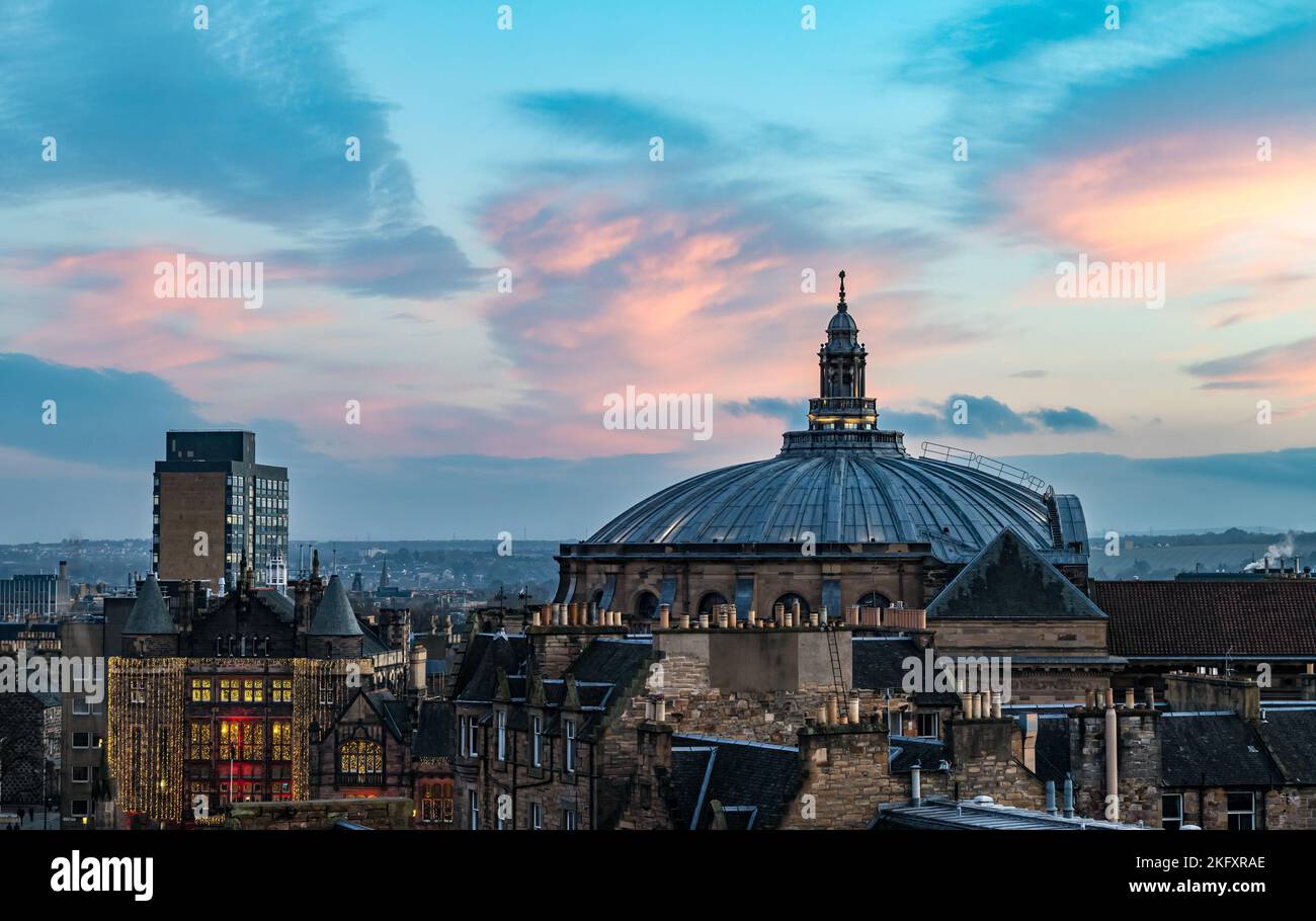 View over rooftops of McEwan Hall dome and Teviot House lit up with ...