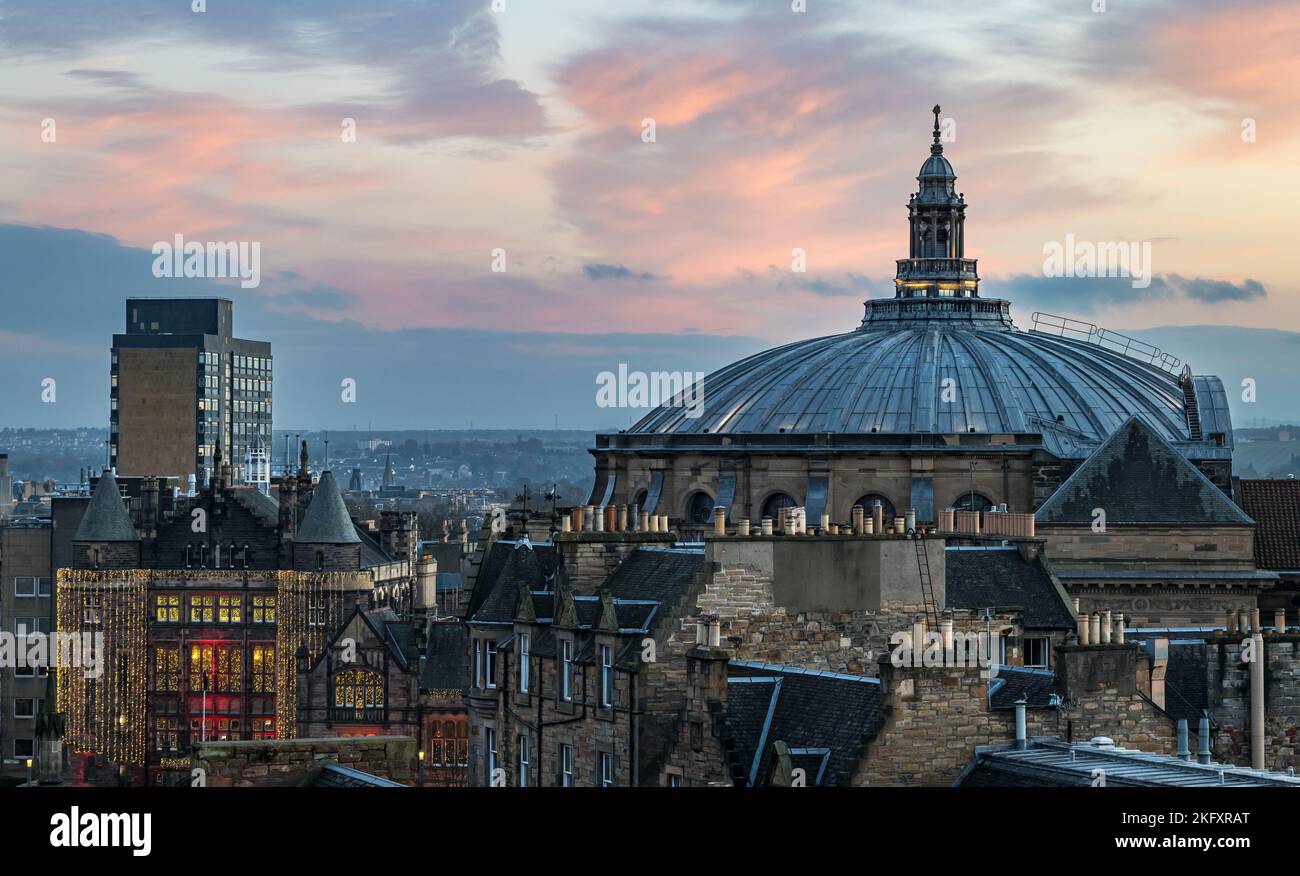 View over rooftops of McEwan Hall dome and Teviot House lit up with ...