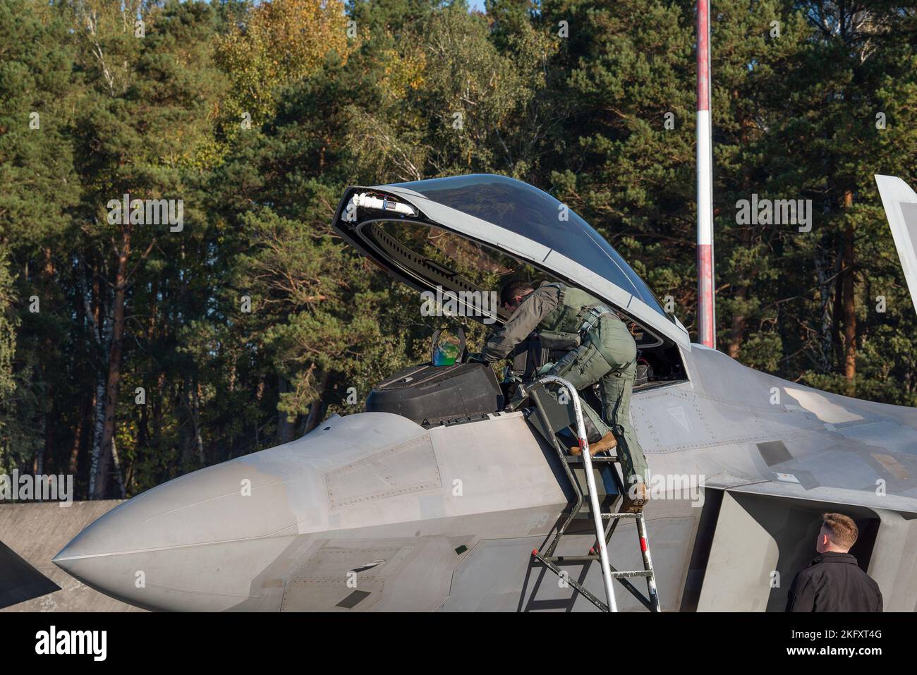 U.S. Air Force Col. Kevin Jamieson, 3rd Wing commander, steps into F-22 ...